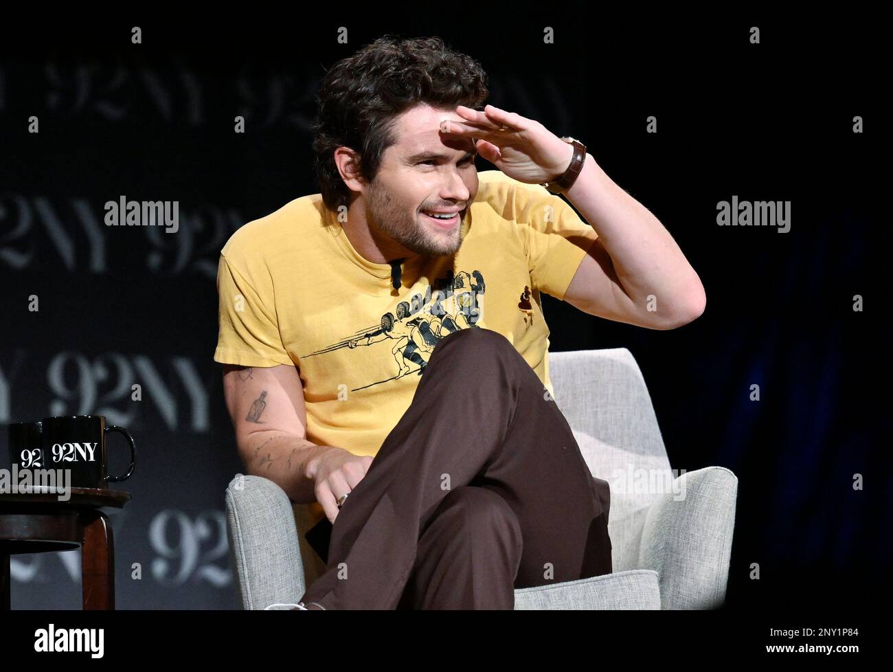 Actor Chase Stokes speaking on stage about the Netflix television ...