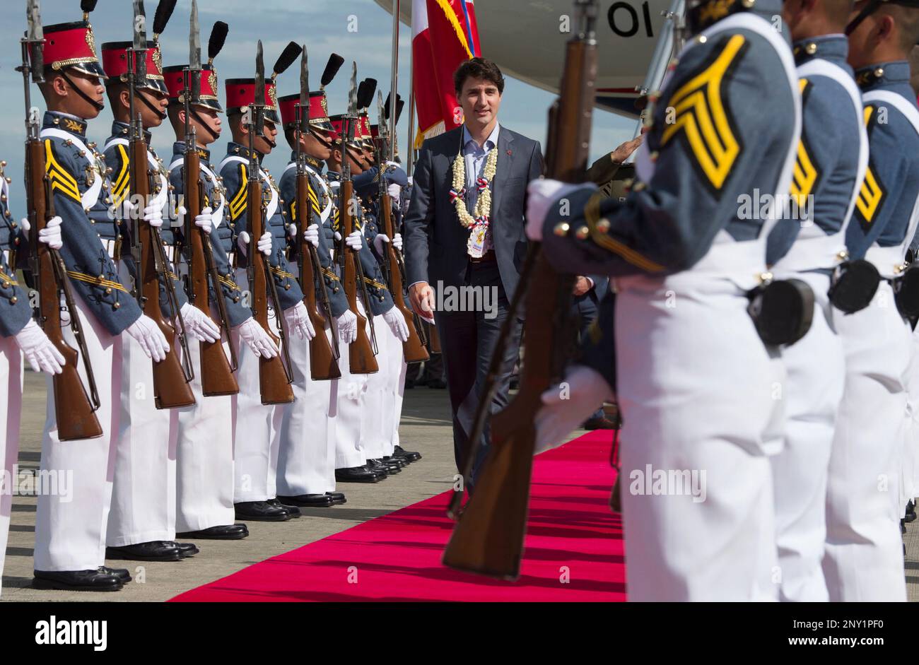 Canadian Prime Minister Justin Trudeau walks through an honour guard as ...