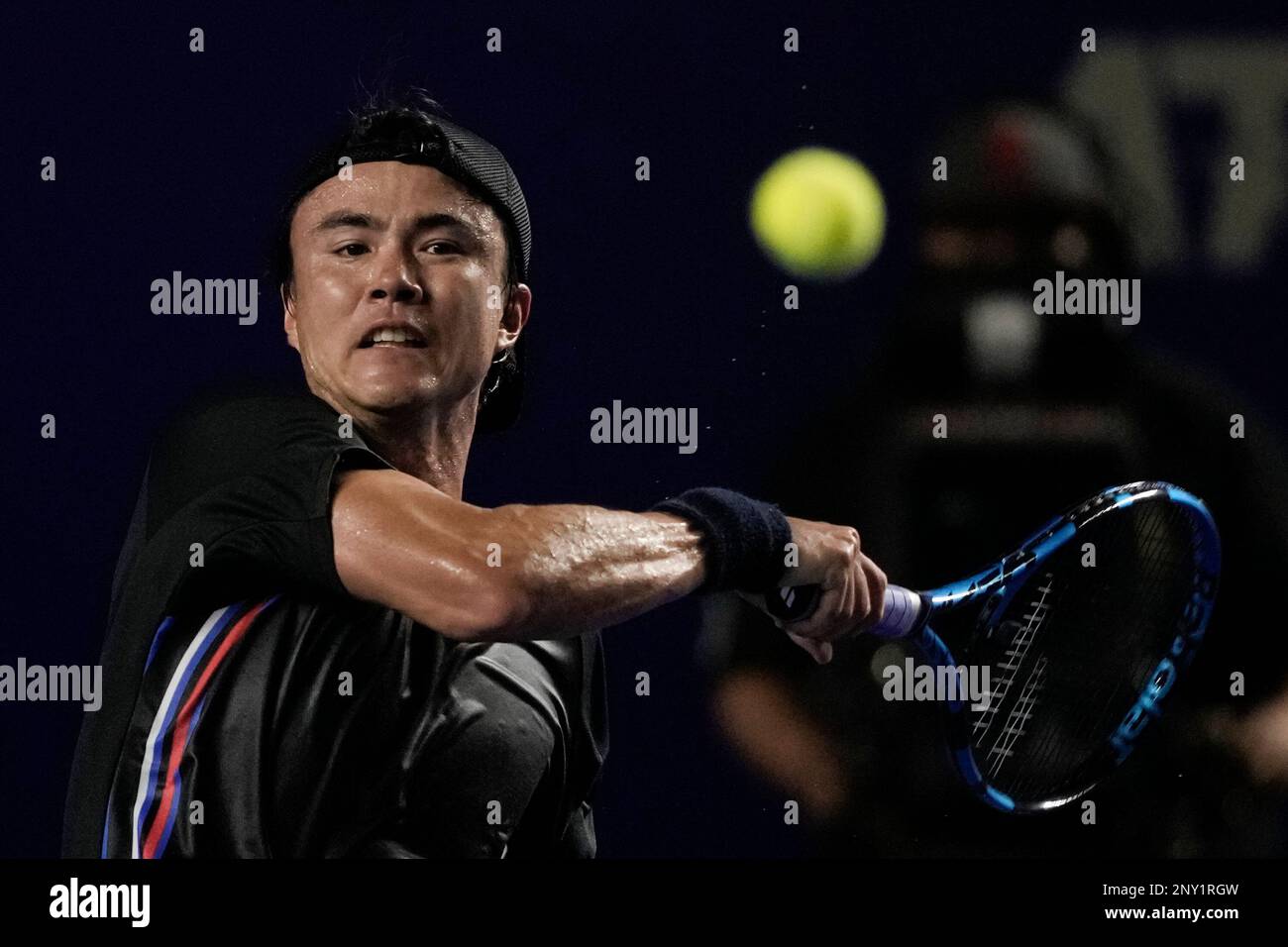 Taro Daniel of Japan, returns a ball against Casper Ruud, of Norway ...