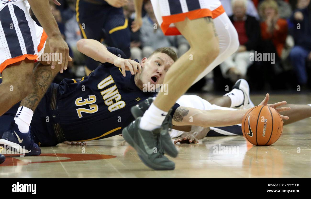 UNC-Greensboro forward Jordy Kuiper (32) grabs a loose ball under ...