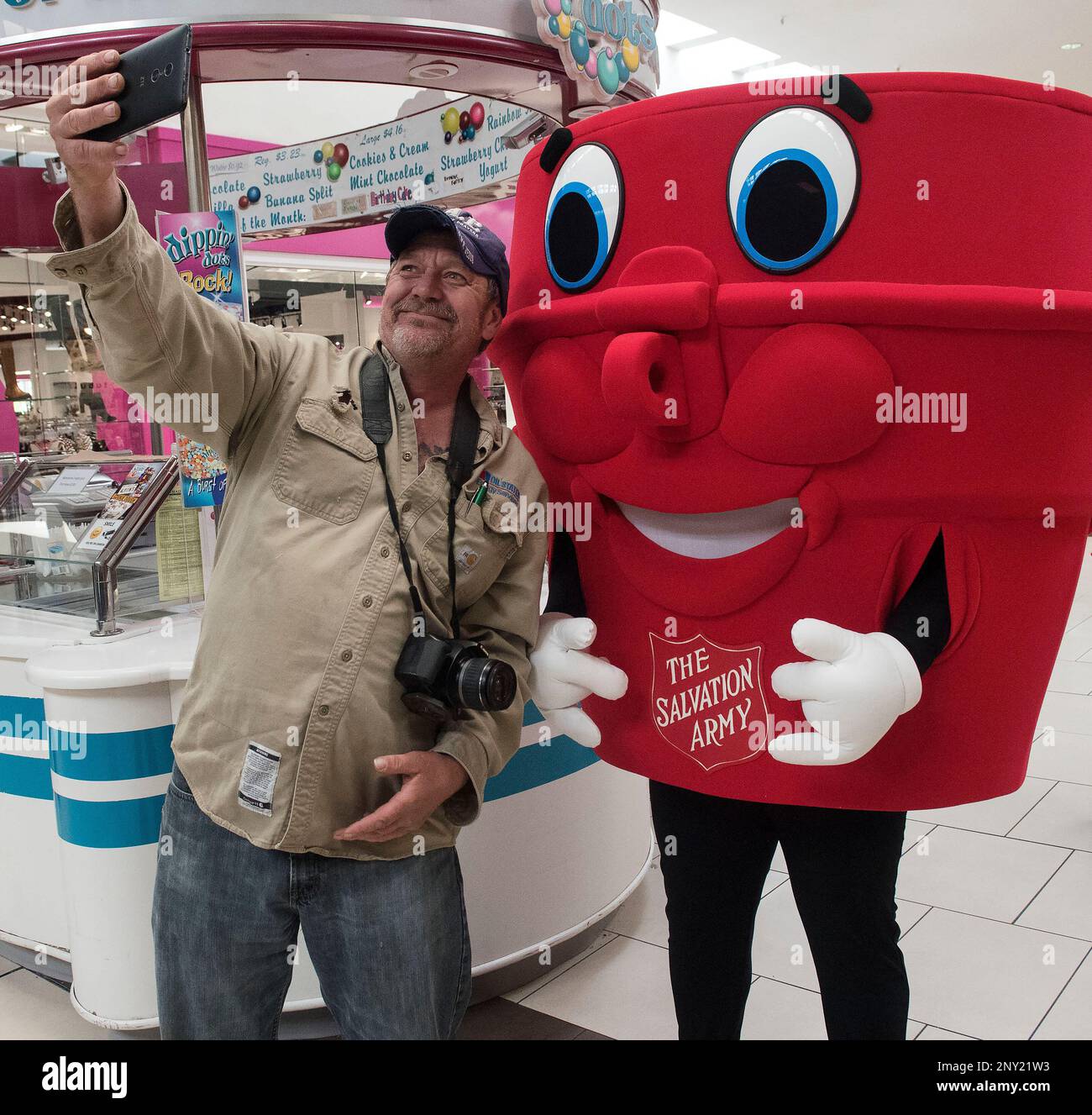 Bell ringer Larry Henson takes a selfie with Captain Kettle during The ...