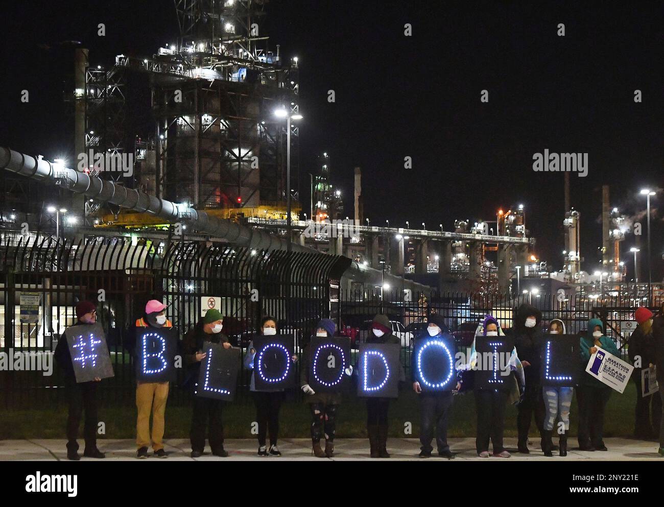 Dozens of demonstrators gather at Detroit's Marathon Petroleum refinery ...