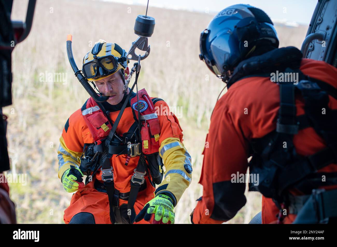Petty Officer 2nd Class Richard Hoefle, a rescue swimmer assigned to ...