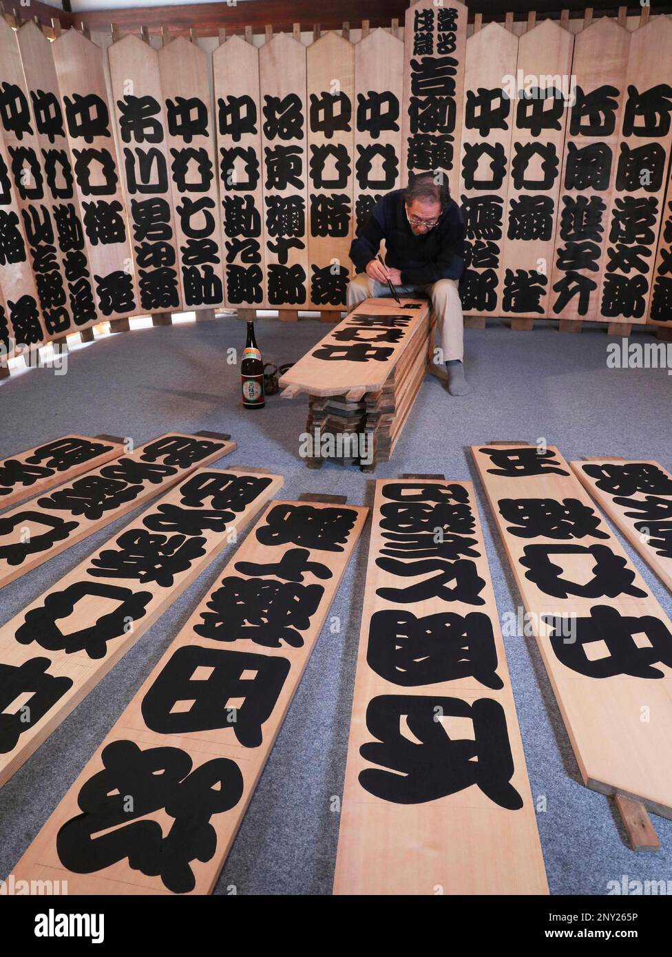 Calligrapher Masaru Inoue writes kabuki actors' names on boards during ...