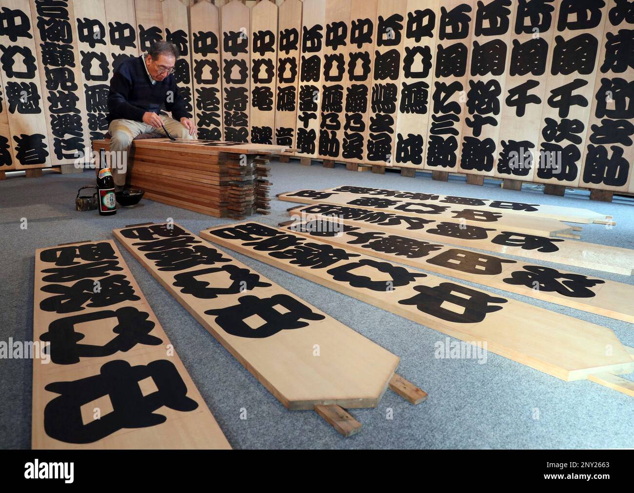 Calligrapher Masaru Inoue writes kabuki actors' names on boards during ...