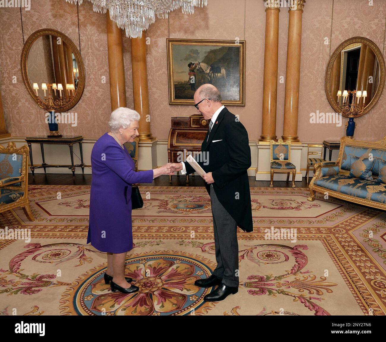 Britain's Queen Elizabeth II shakes hands with Woody Johnson, the US ...