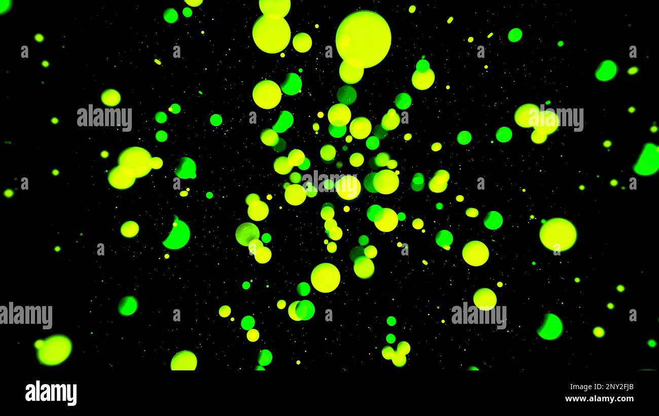 Abstract flying green spheres over the black background. Motion. Spreading 3D round shapes Stock ...