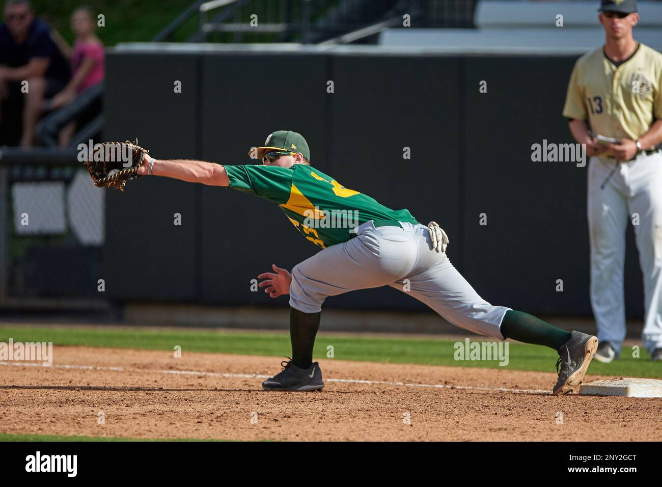 Siena Saints first baseman Nick Duarte (33) stretches for a throw ...
