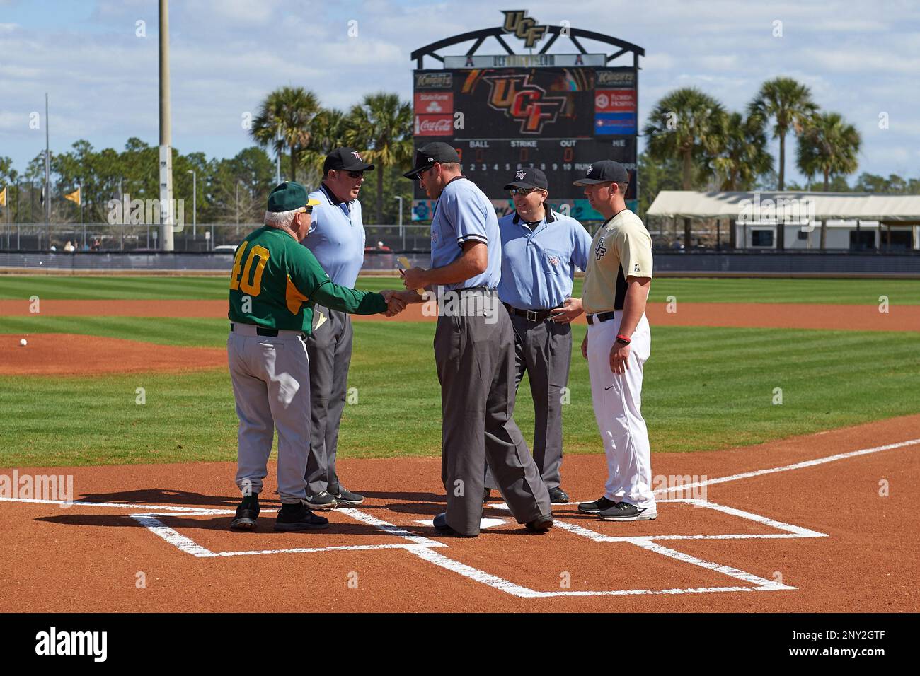 Siena Saints head coach Tony Rossi (40) during the lineup exchange with ...