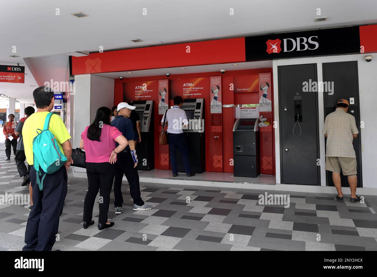 People queuing to use the atms at the DBS bank outlet in Bedok Central. DBS chief executive ...