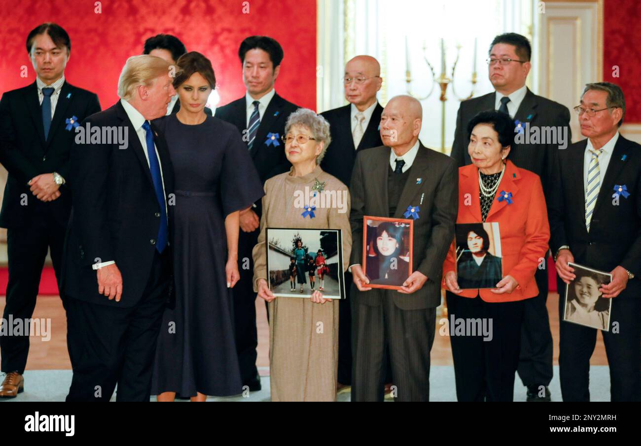 U.S. President Donald Trump and first lady Melania speak to families of ...