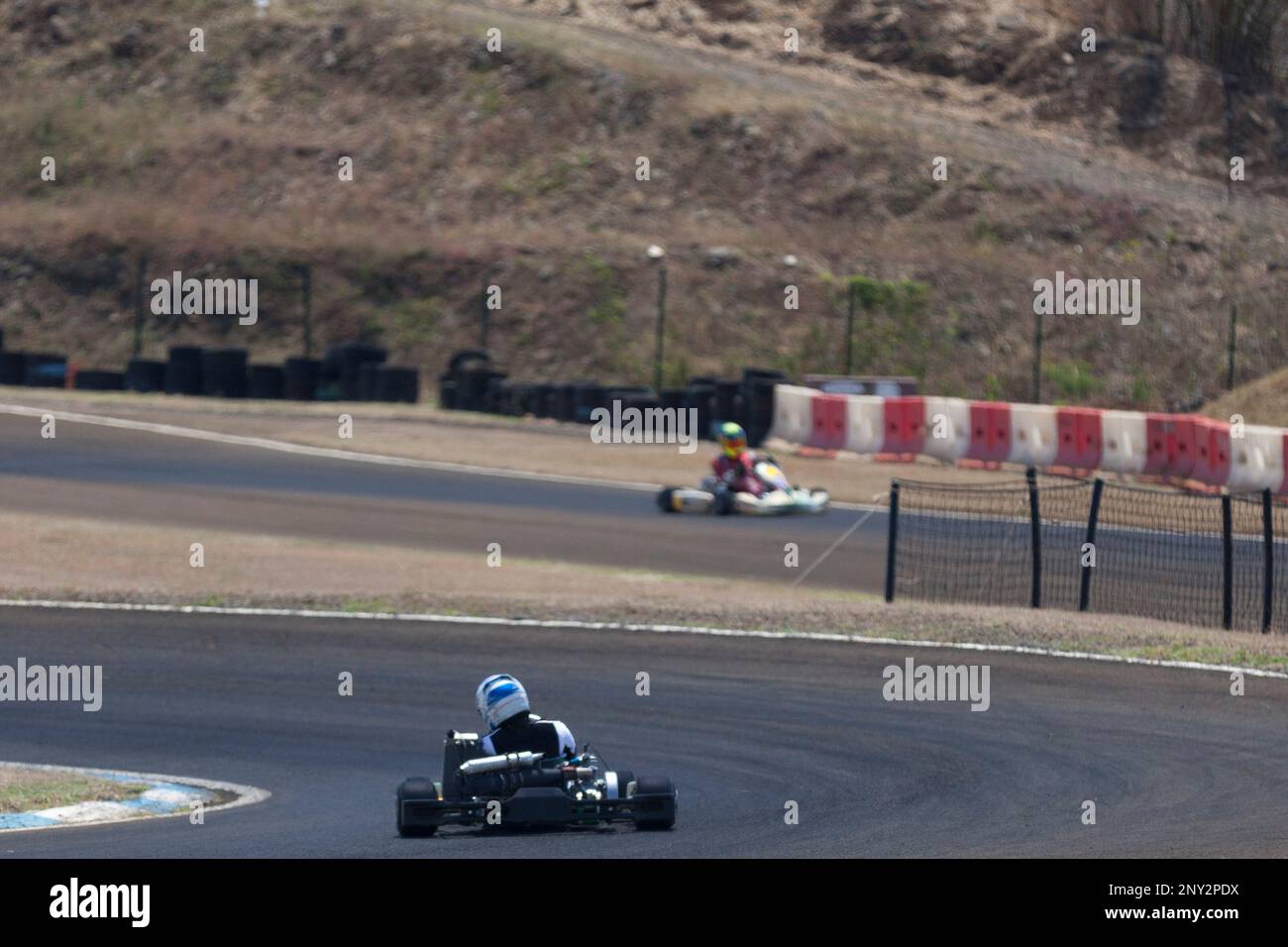 Go kart racing on circuit Stock Photo - Alamy