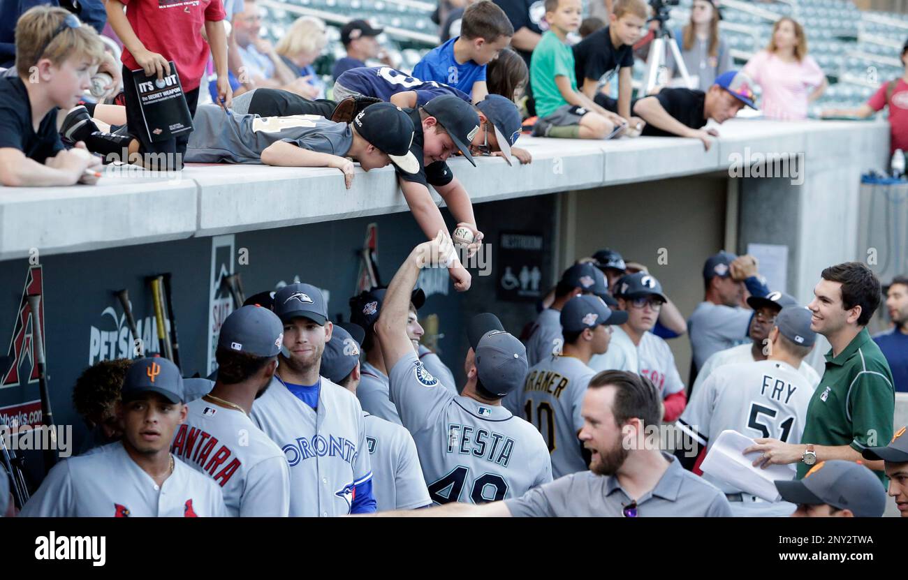 Players sign autographs for the fans during the MLB Fall Ball league ...