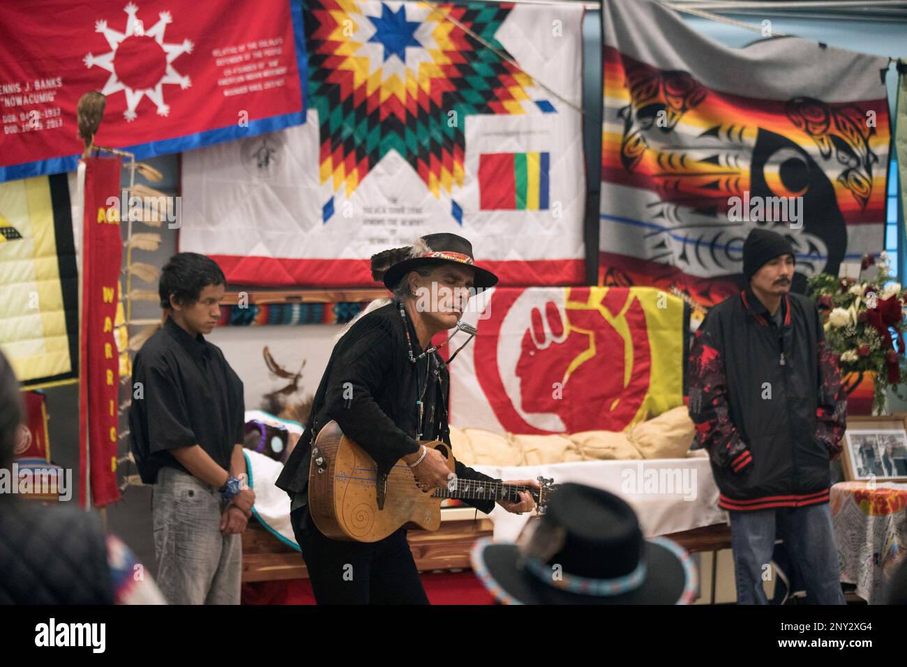 Robby Romero, of Taso, N.M., sings a song for his friend Dennis Banks ...