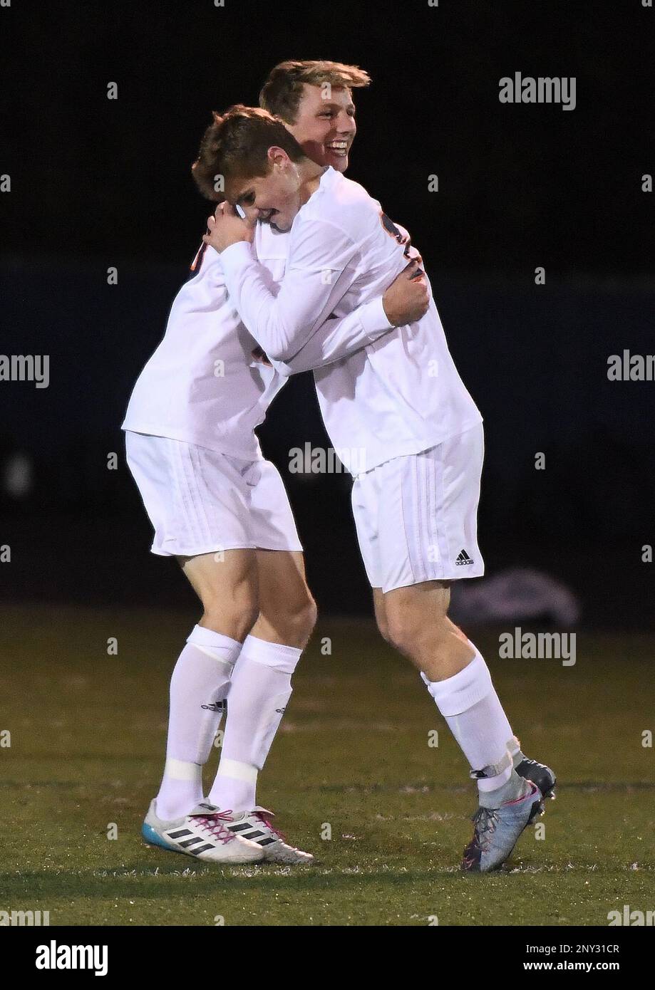 Naperville North's Patrick Koenig , right, celebrates after scoring a ...