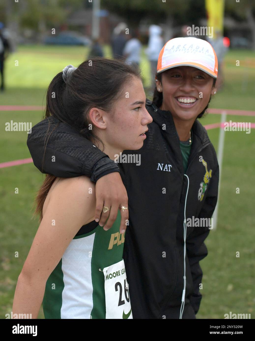 Nov 1, 2017; Long Beach, CA, USA; Sydney Carlson (left) is embraced by ...