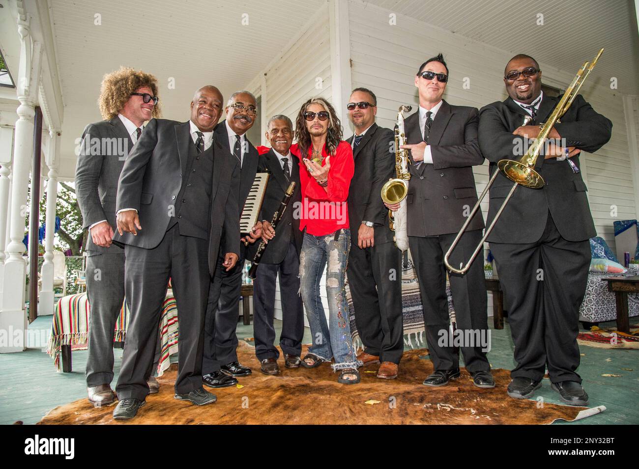 Steven Tyler, center, poses with Ben Jaffe, Mark Braud, Charlie Gabriel ...