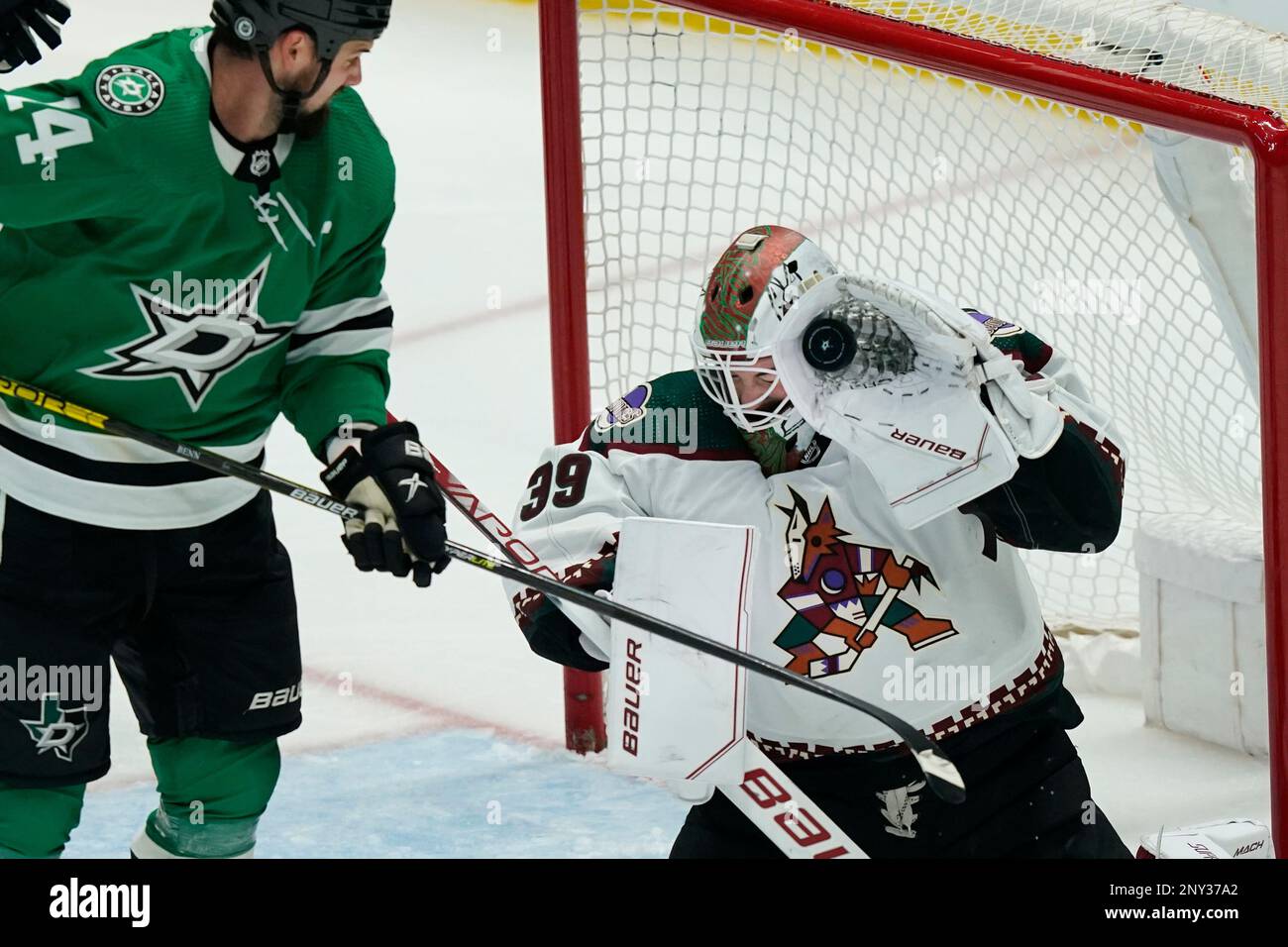 Arizona Coyotes goaltender Connor Ingram (39) catches the puck in front ...
