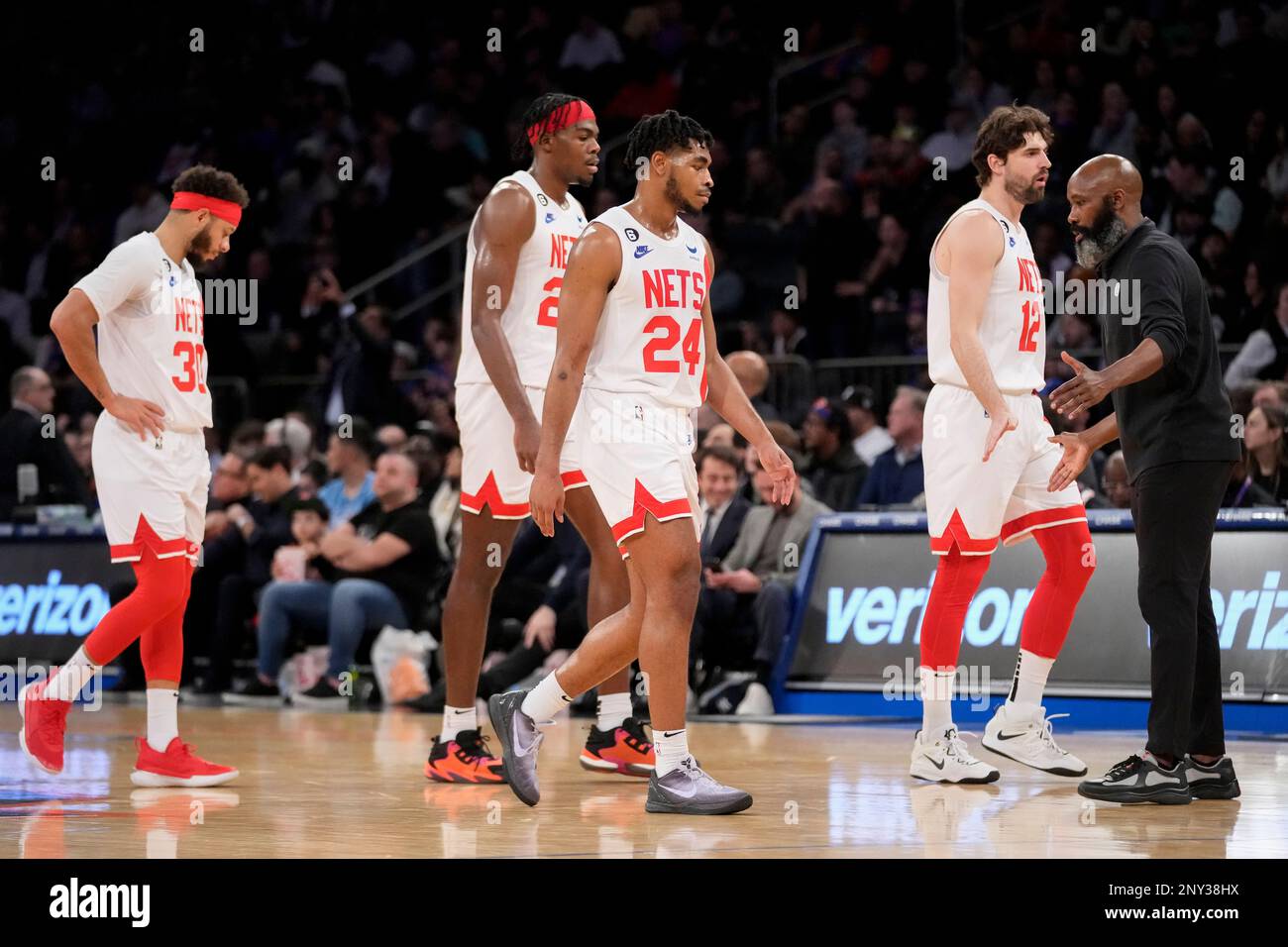 Brooklyn Nets guard Cam Thomas (24) and his teammates walk back to the ...