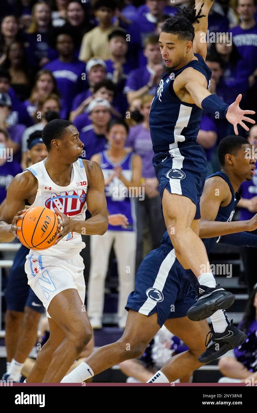 Northwestern guard Chase Audige, left, looks to pass as Penn State ...