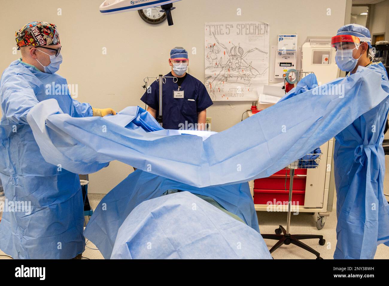 Instructors act as surgeons during a mock surgery while 68D operating ...
