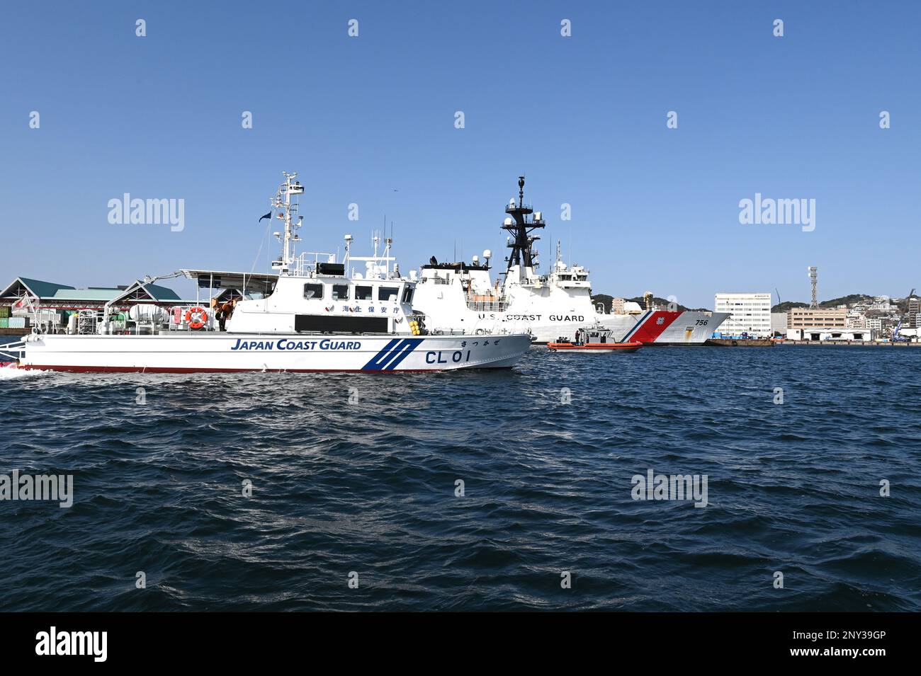 Crews aboard the Japan Coast Guard patrol craft Satsukaze and the U.S ...