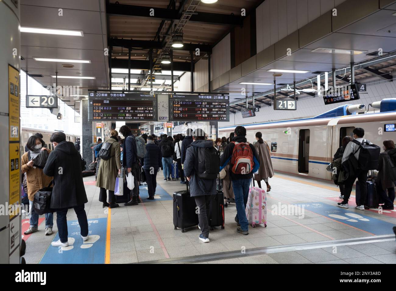 Tokyo, Japan. 19th Feb, 2023. Intercity rail passengers line up to ...