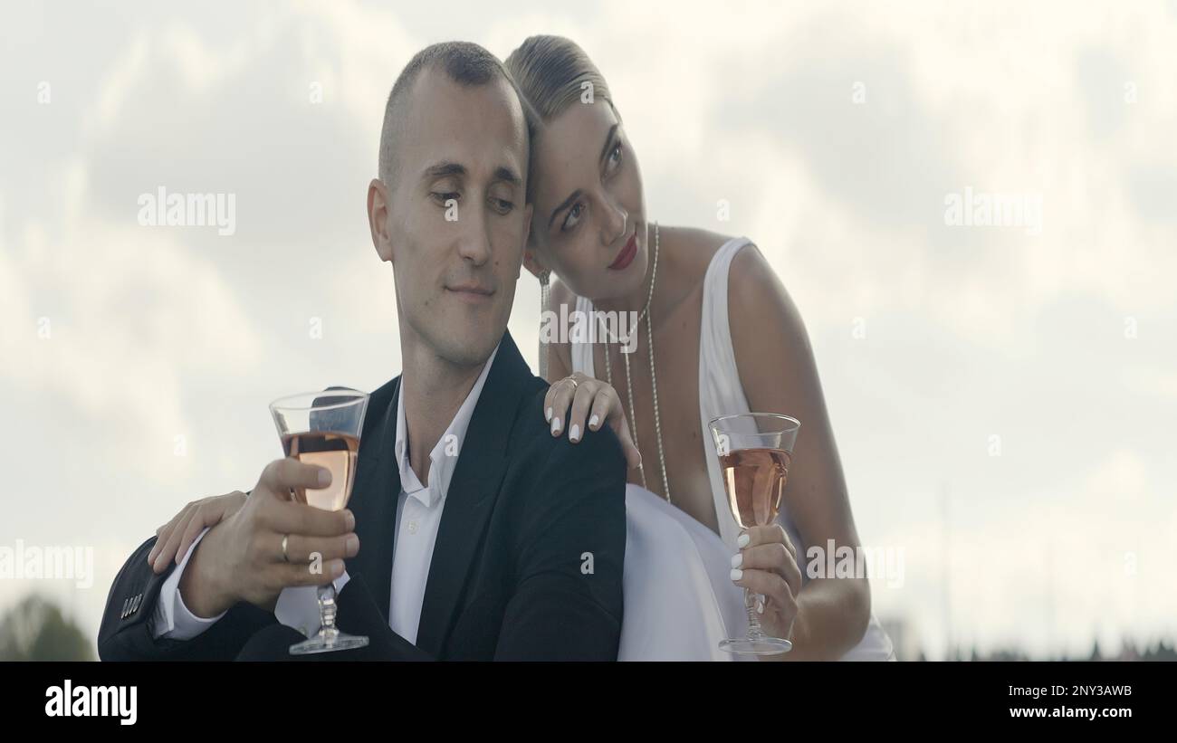 A dreaming couple. Action. A beautiful woman with her hair pulled back ...