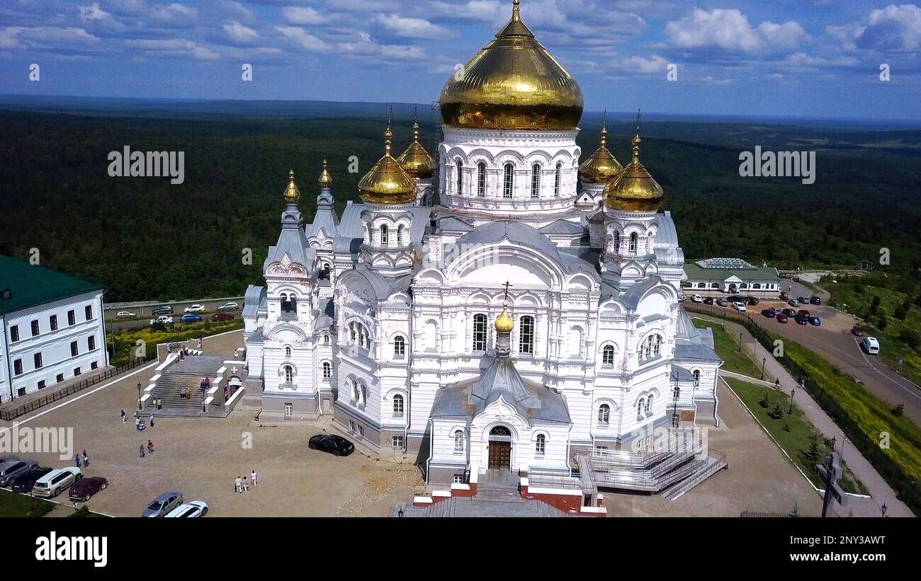 Huge white church. Drone view. Clip. A green landscape with a temple ...