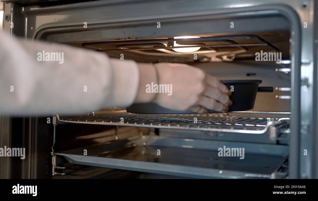 The concept of cooking. Action. A heated stove into which a frying pan ...