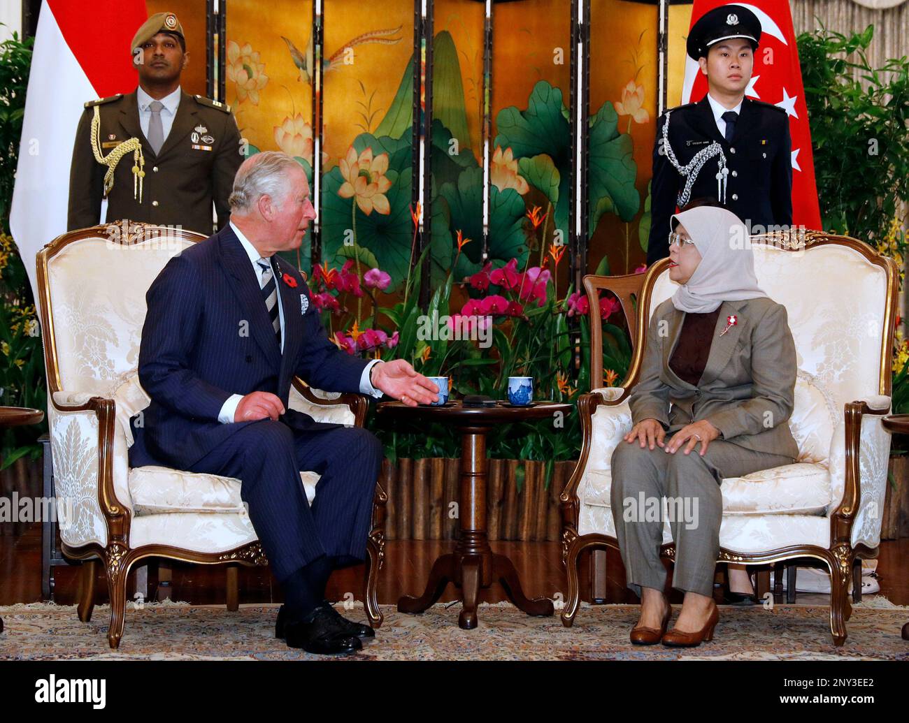 Britain's Prince Charles, left, meets Singapore's President Halimah ...