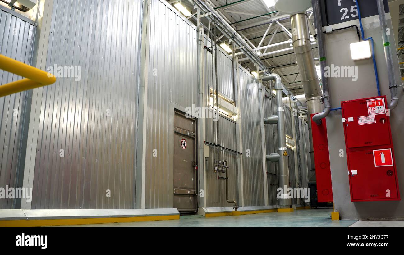 Large isolated room. Scene. A huge empty garage with gray walls. High ...