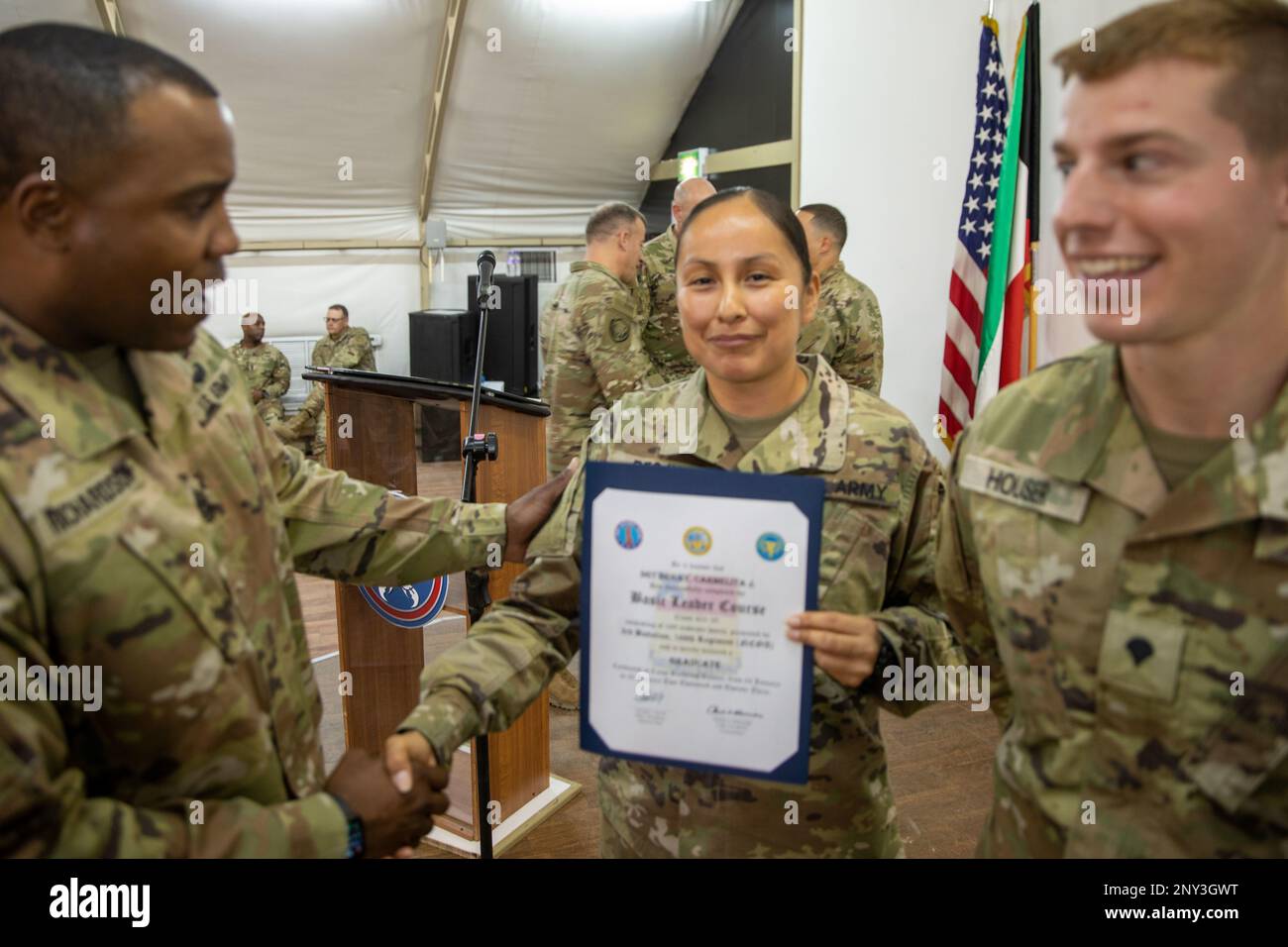 U.S. Army Sgt. Carmelita Begay poses for a picture while shaking hands ...