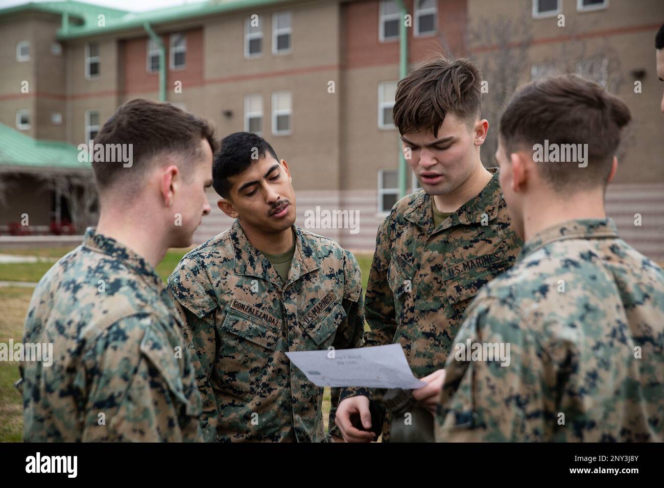 U.S. Marines from various units review a physical fitness plan during a ...