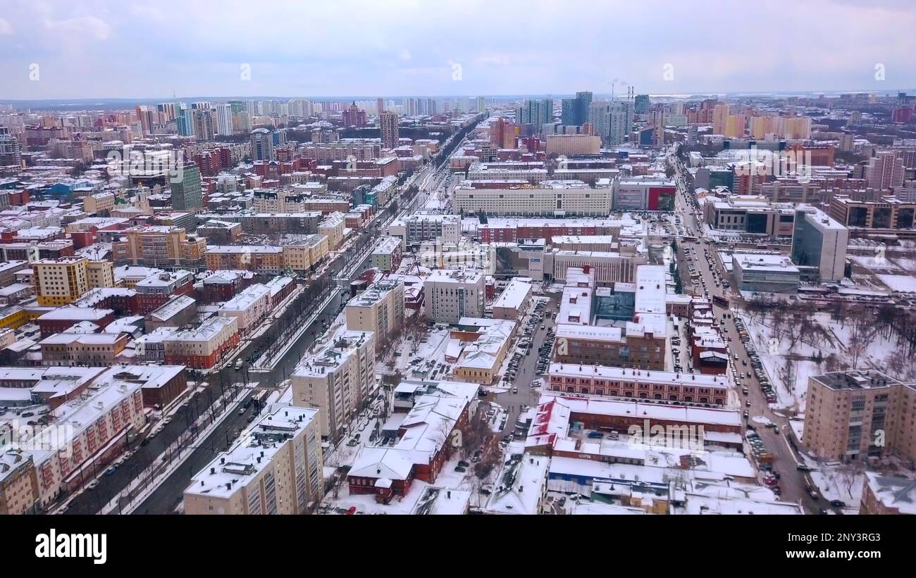 Winter city with high-rise buildings. Clip.View from a helicopter on a ...