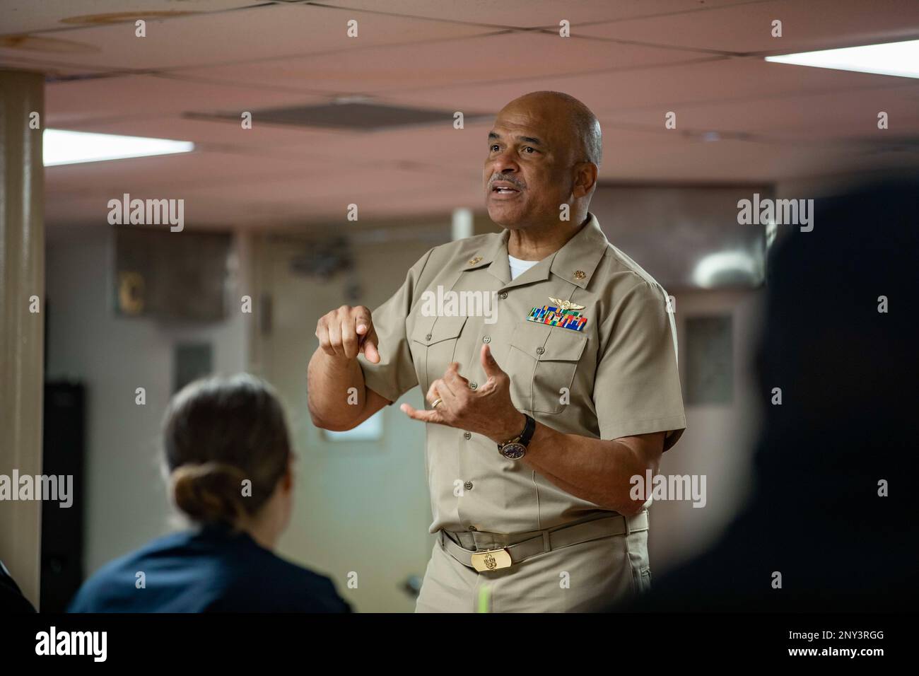 Retired U.S. Army Chief Warrant Officer 5 Phillip Brashear meets with the crew of the Wasp-class ...