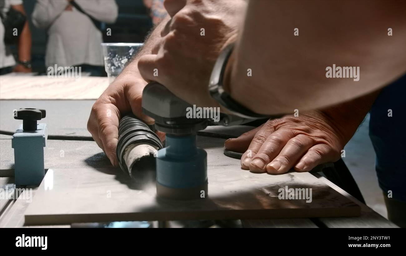 Carpenters process wooden board and vacuum dust. Creative. Close-up of ...