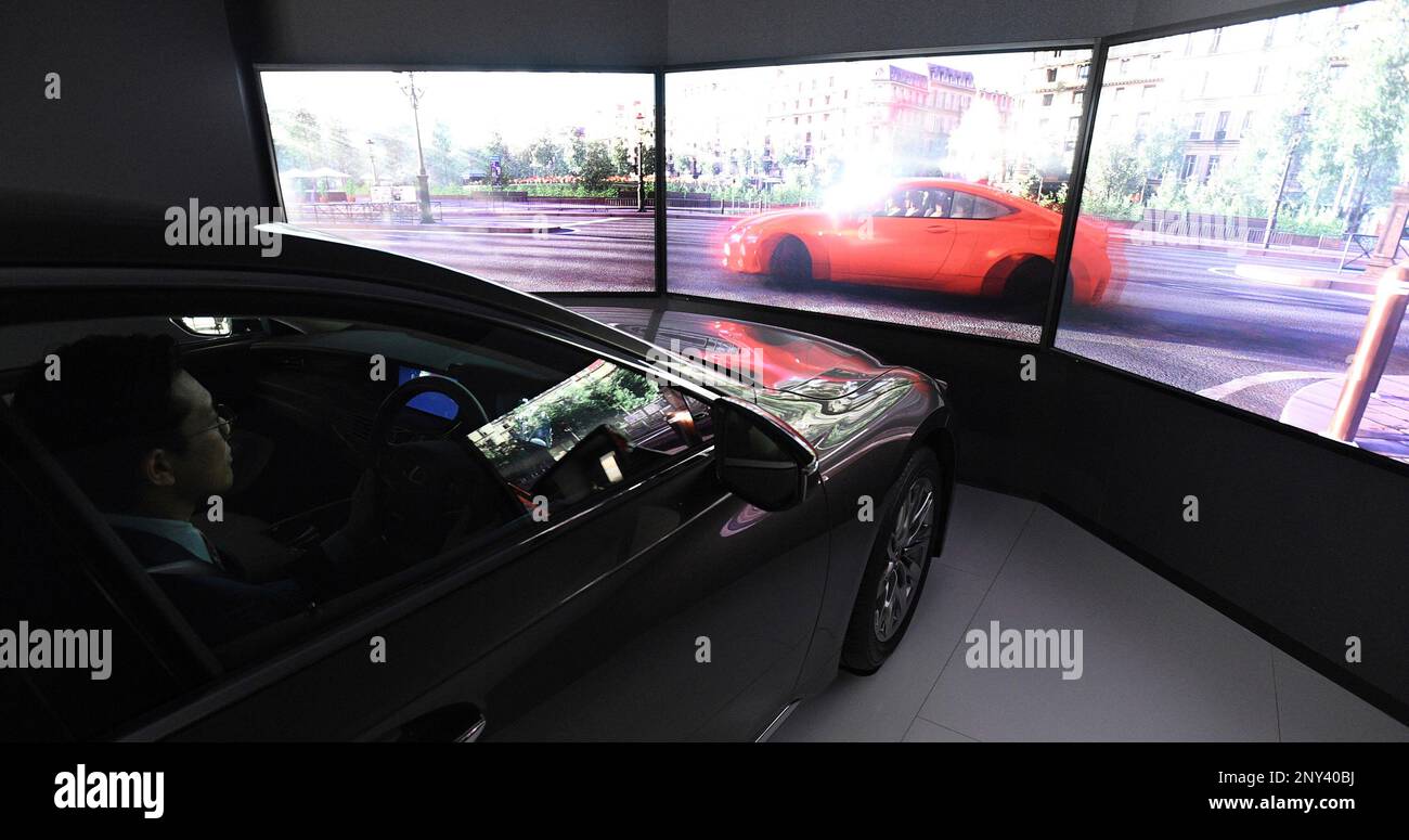 Visitor experiences autonomous driving by using a simulator of Lexus LS ...