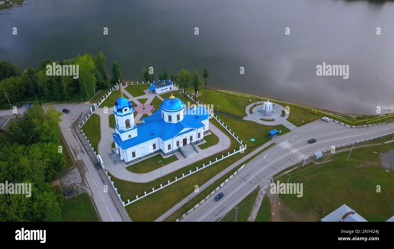 Top view of church with blue domes on river bank. Clip. White church ...