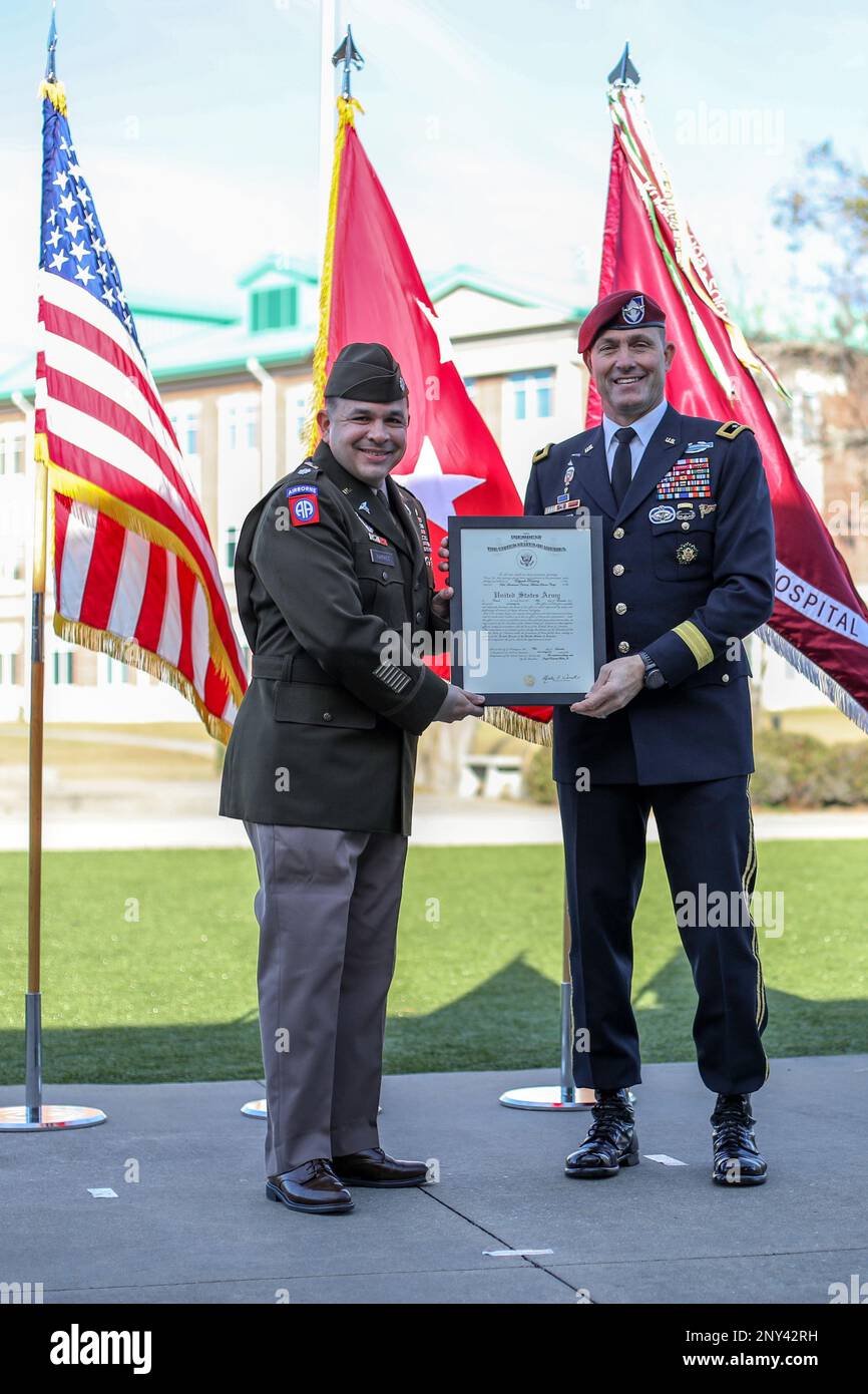 Col. Edgardo Ramirez, commander of the 14th Field Hospital, receives a ...