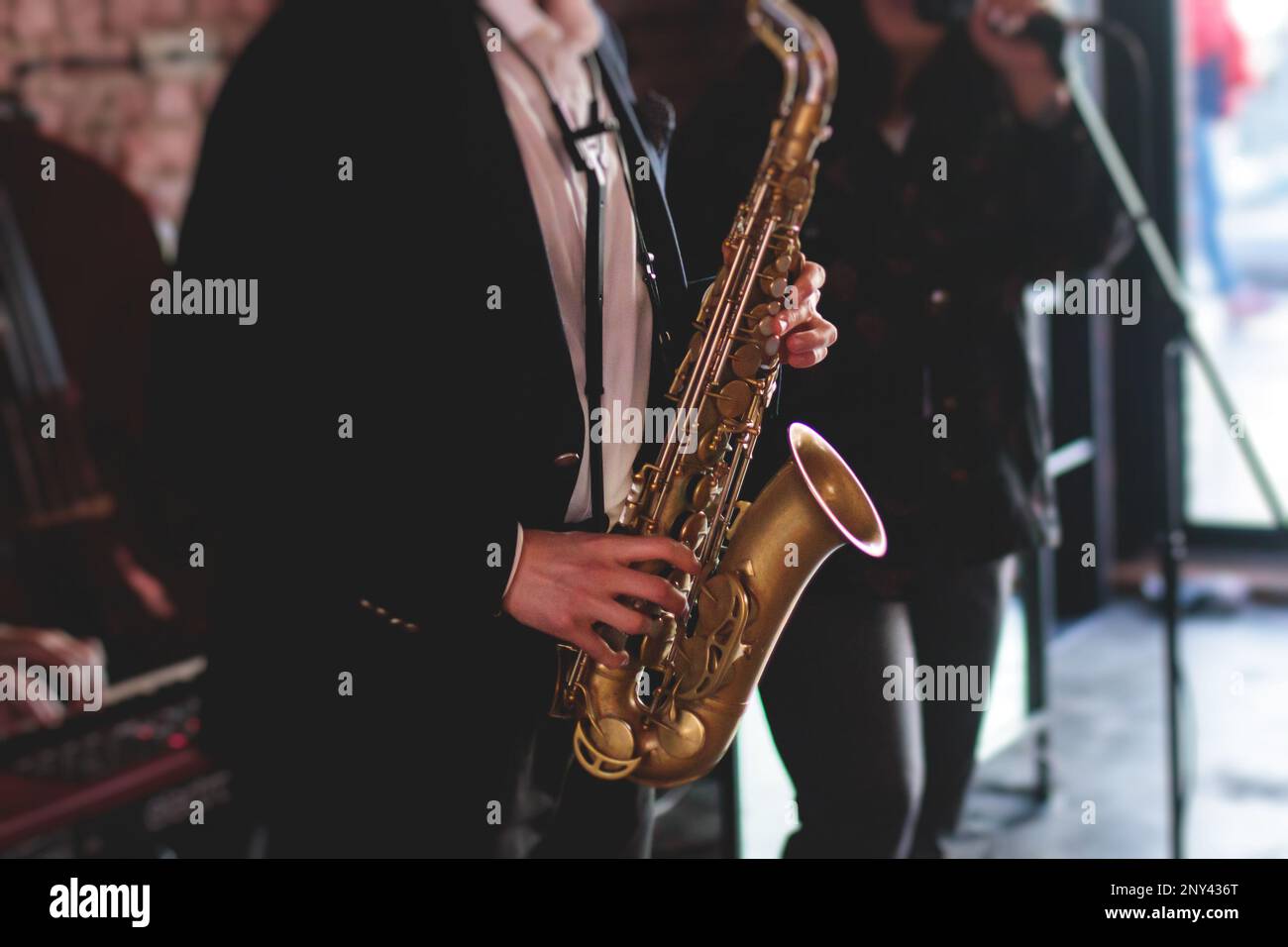 Concert view of saxophonist on a stage, a saxophone sax player with ...