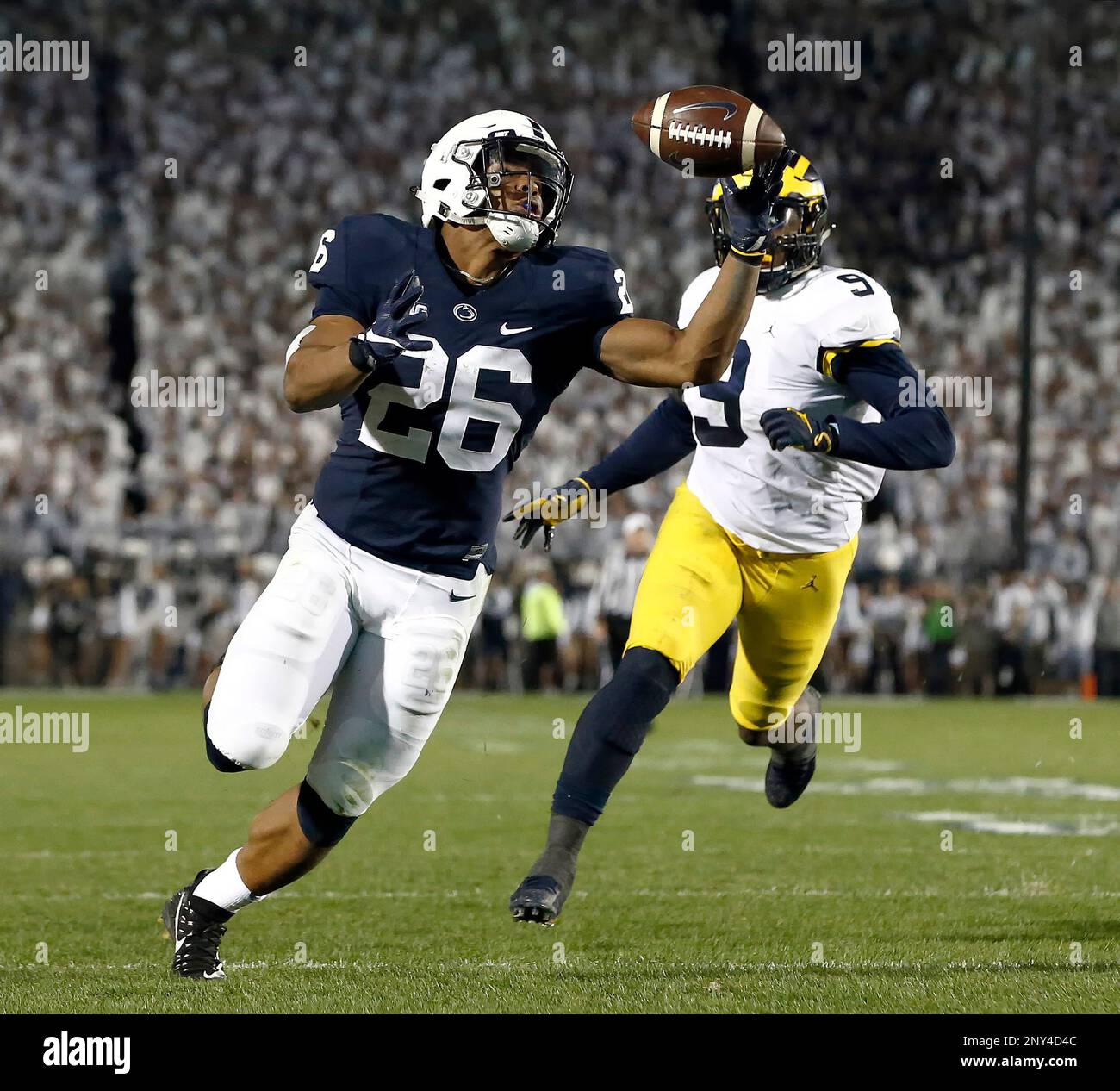 Penn State's Saquon Barkley (26) gains control of a pass and takes it ...