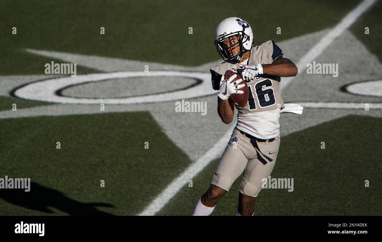 Utah State wide receiver Jordan Nathan (16) secures a long pass on his ...
