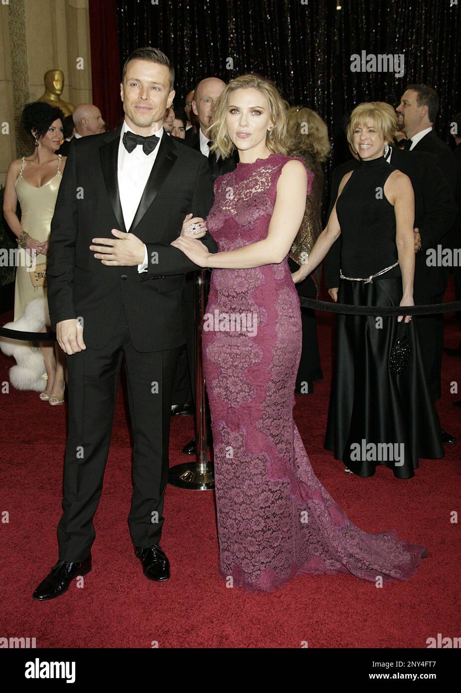 Actress Scarlett Johansson (R) and agent Joe Machota arrive at the 83rd ...