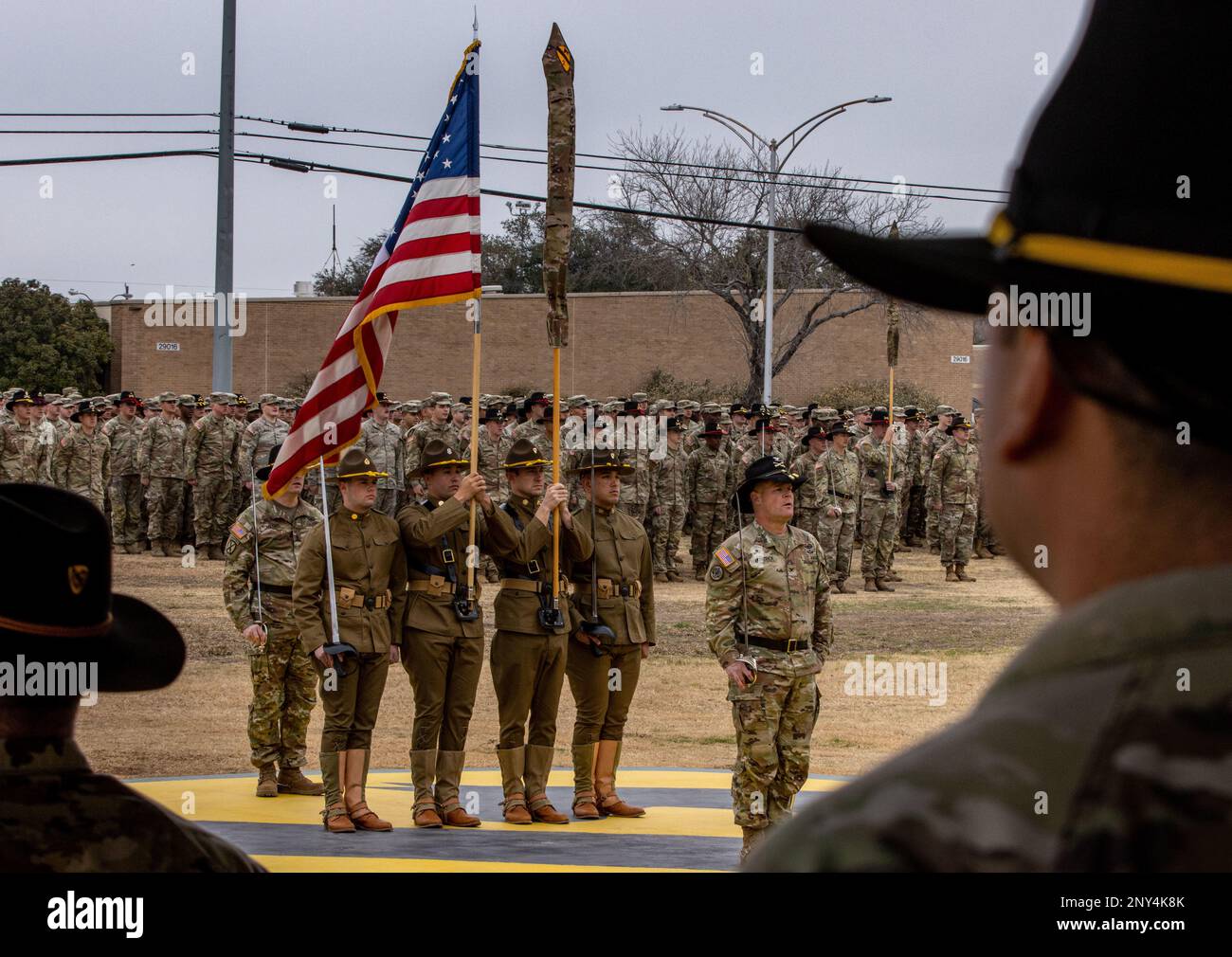 1st Cavalry Division Troopers look toward the newly cased colors of the ...
