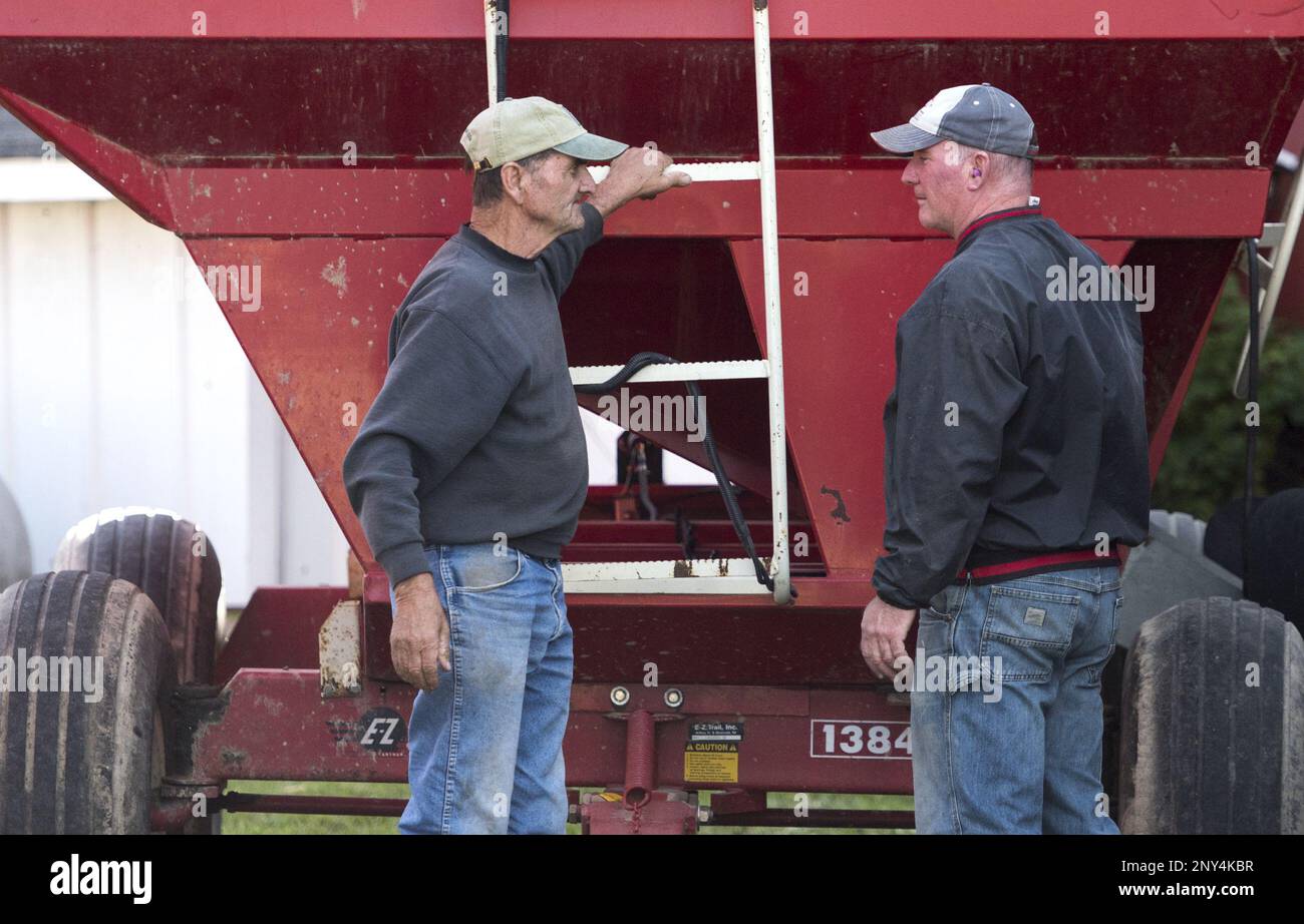 In a Tuesday, Oct. 17, 2017 photo, Harold Hanuska, left, speaks to fellow farmer Jeff McNally in ...