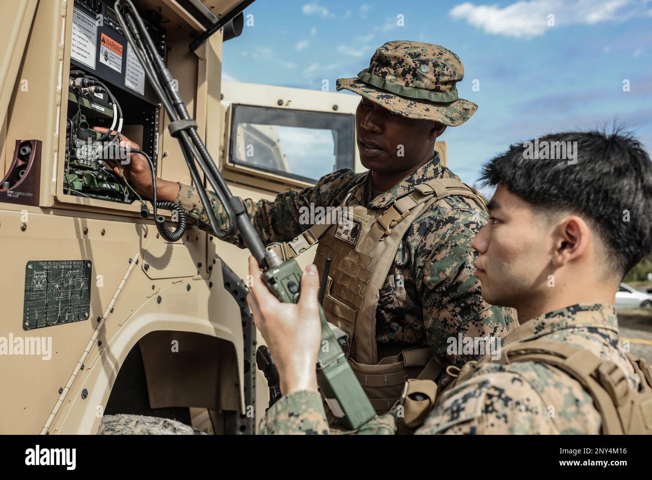U.S. Marine Corps Staff Sgt. Jacquez Freeman, a watch chief, and Cpl. Brennan Ekstrand, a ...