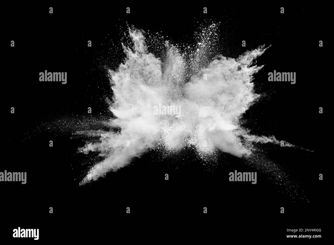 White powder explosion isolated on black background.White dust ...