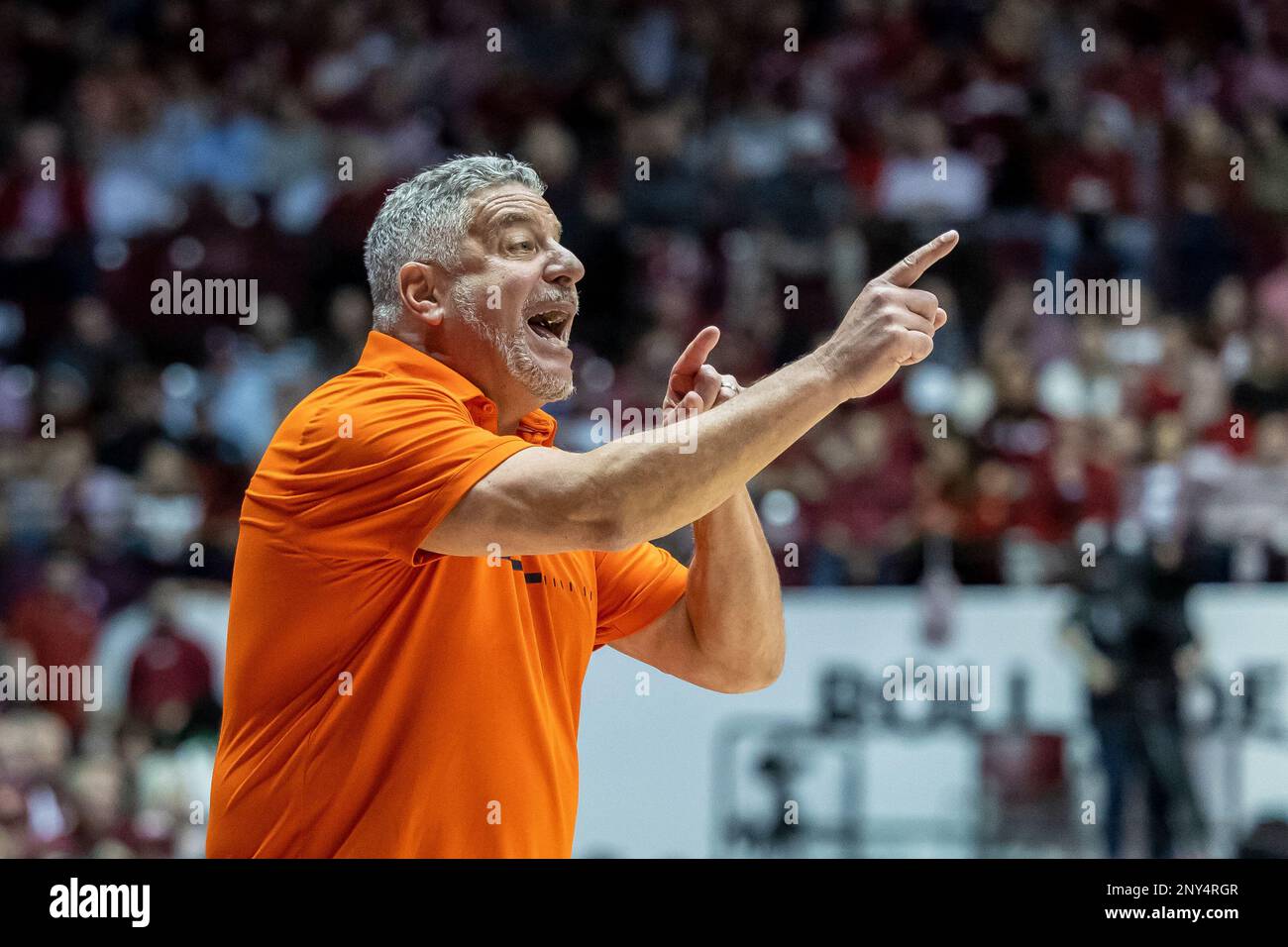Auburn Head Coach Bruce Pearl Signals In During The First Half Of An