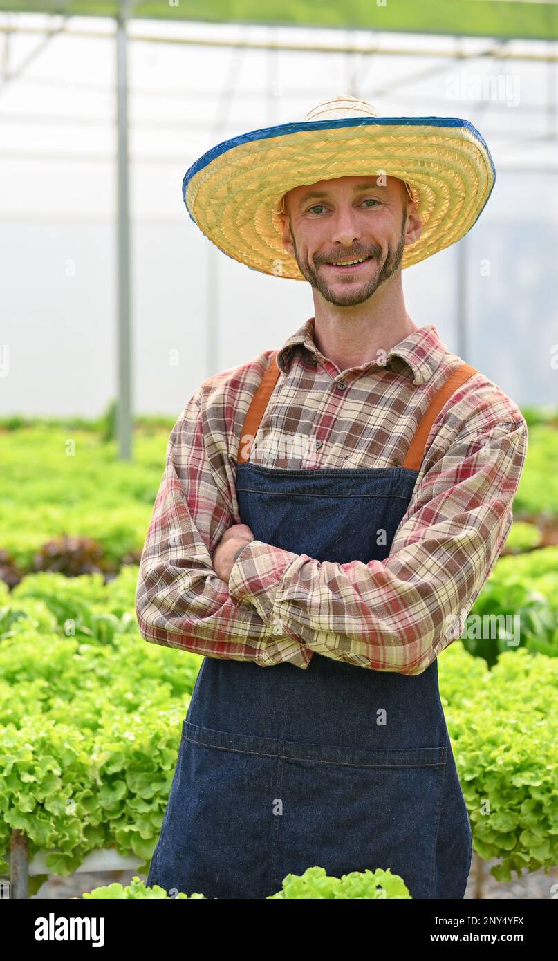 Portrait, Successful and happy Caucasian male farmer with a straw hat ...